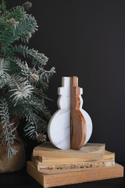 white marble and acacia wood snowman